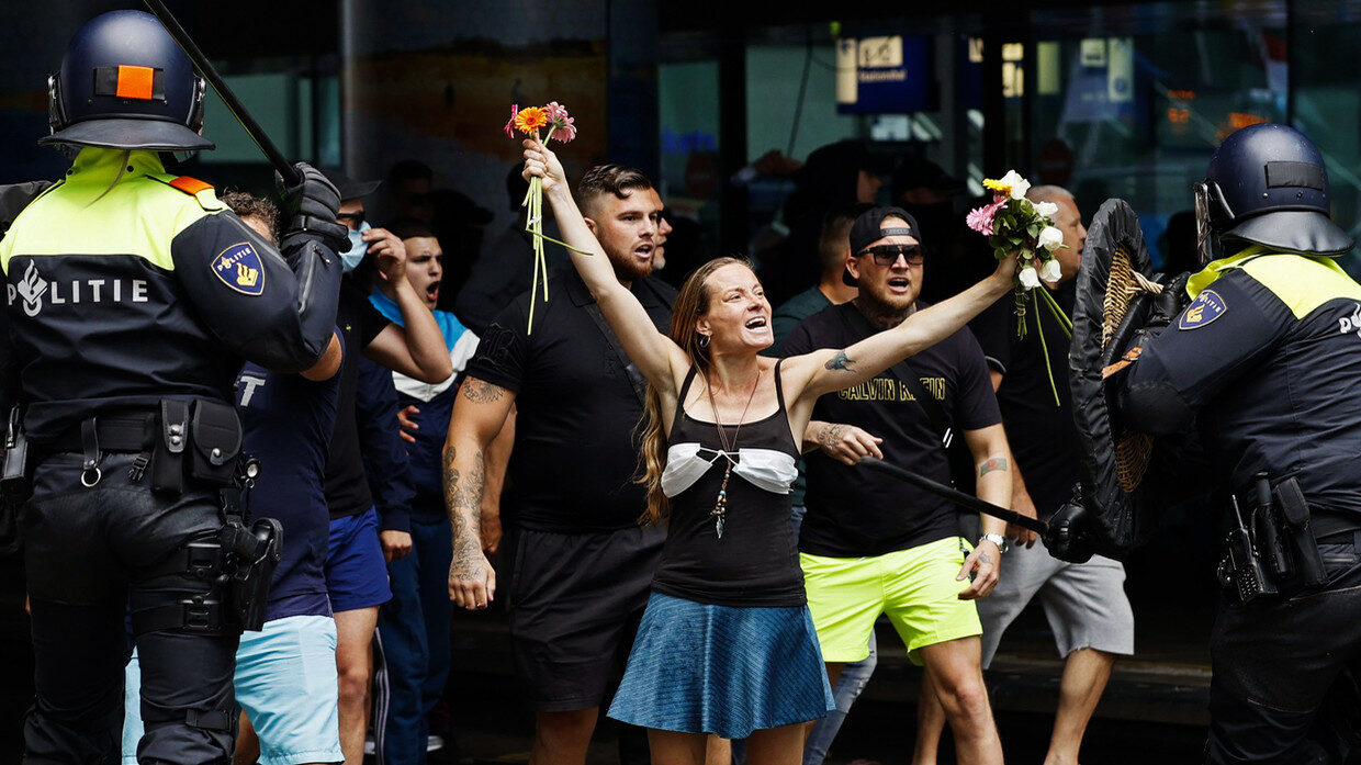 Dutch riot police fire water cannon to disperse rally against ...